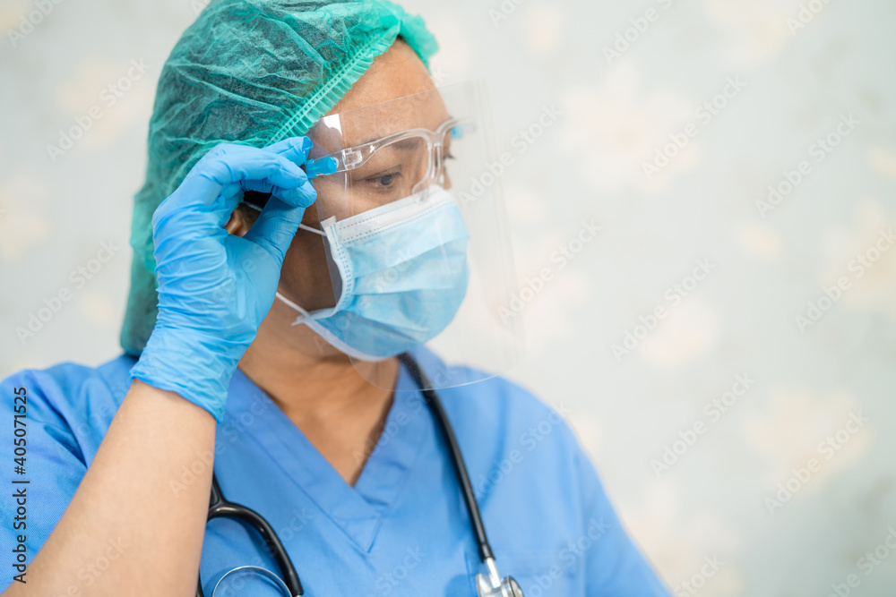 Asian doctor wearing face shield and PPE suit new normal to check ...
