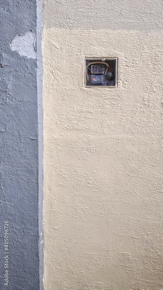 the surface of the wall on which the red button is located. texture ...