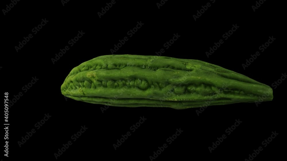 Realistic render of a spinning Bitter Melon (Bitter Gourd) on black ...