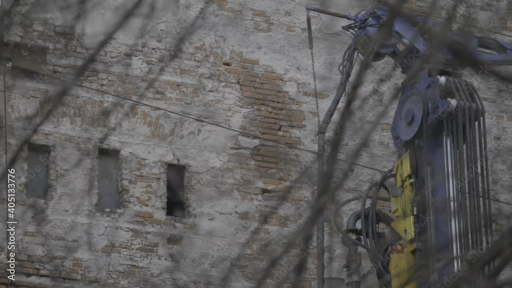 An old brick building facade, taken with a telephoto lens, while camera ...