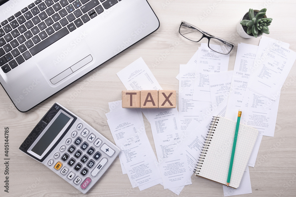 Bills and calculator with checks for goods and services.. calculator to ...