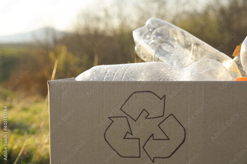 Young volunteers cleaning area in park,with keep plastic bottle at ...