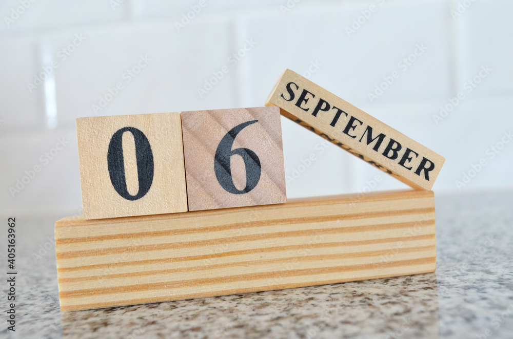 September 6, Cover design with number cube on a white background and ...