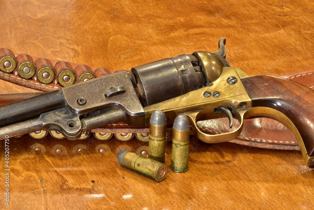Navy colt, gun belt and bullets on a worn bar top Stock Photo | Adobe Stock