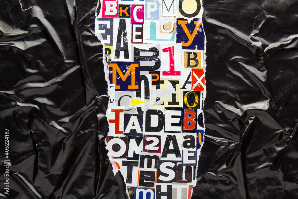 Torn and crumpled black glossy paper on collage from clippings with ...