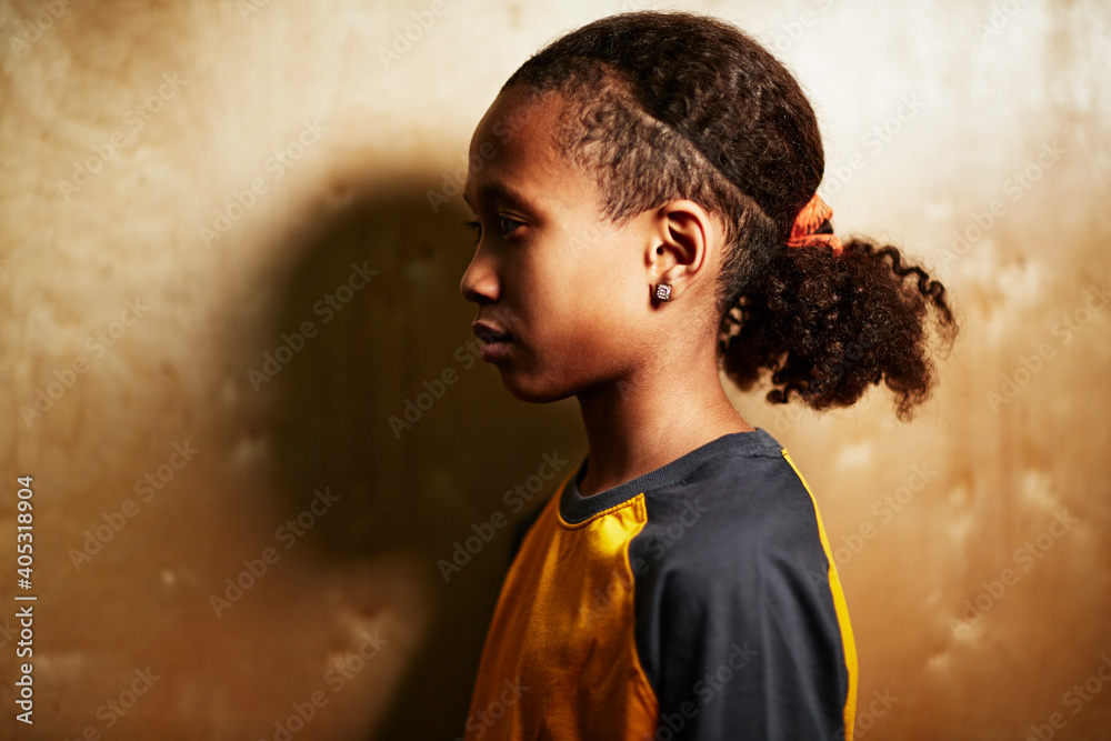 Boy with pony tail, side view Stock Photo | Adobe Stock