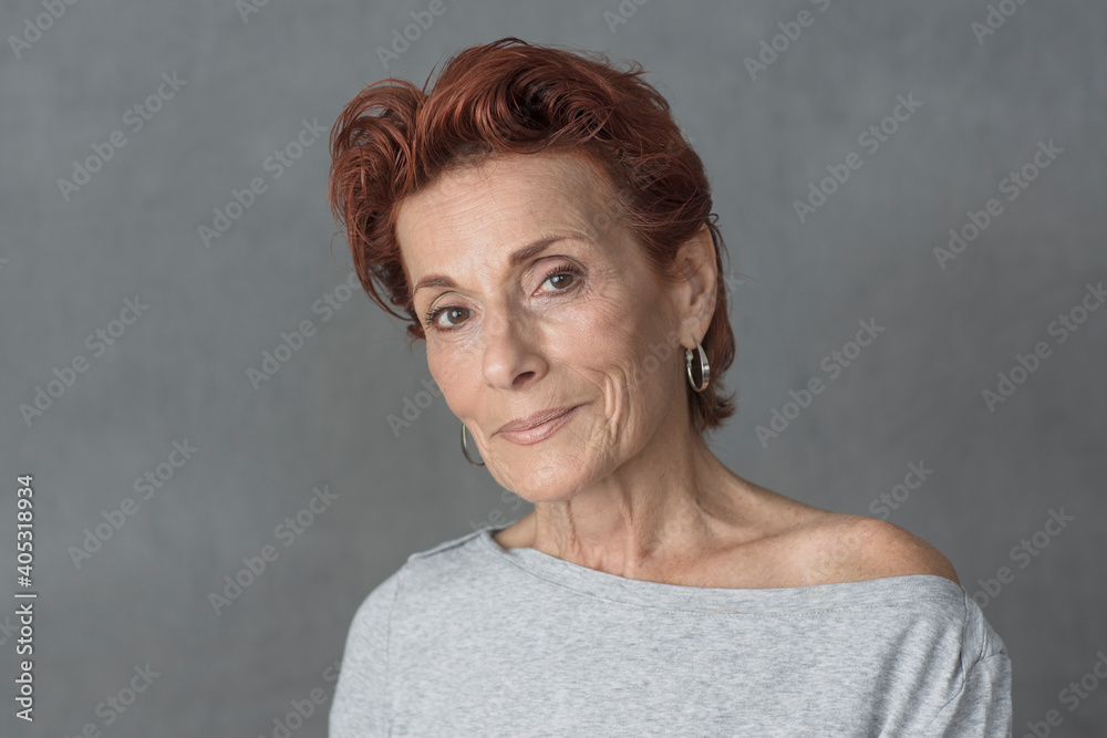 Studio Portrait Of Beautiful Mature Woman With Short Red Hair Stock