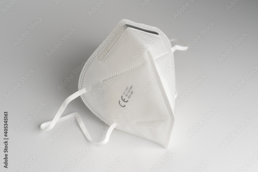 FFP2 face mask in white in front of clean background. Certified ...