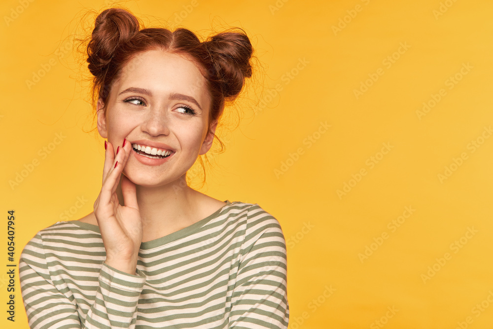 Young lady, pretty ginger woman with two buns and healthy skin. Smile ...
