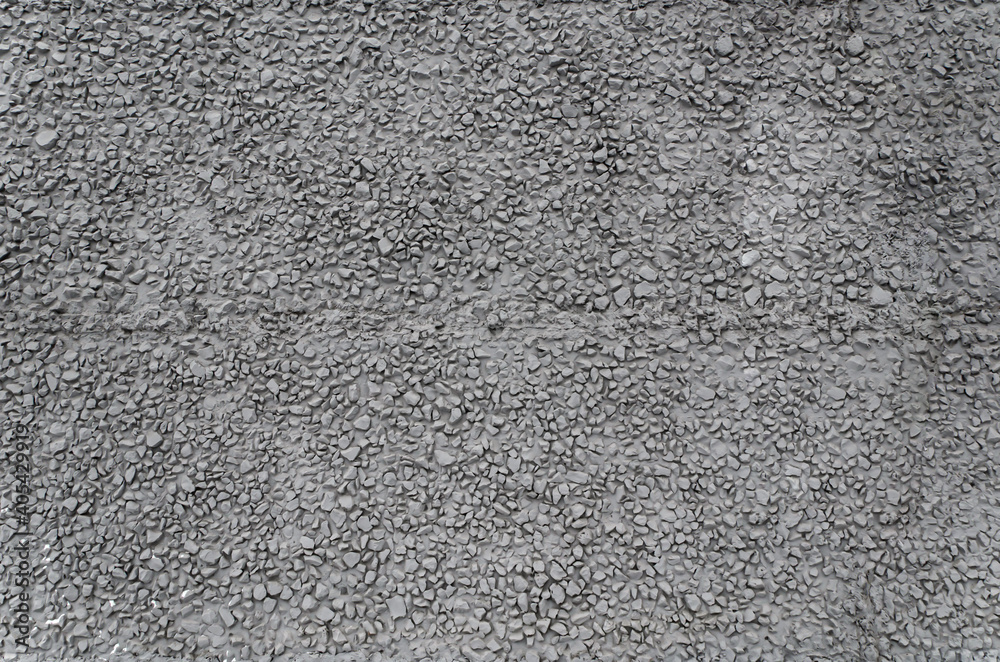 Texture of dark gray building facade cement plaster with fine gravel ...