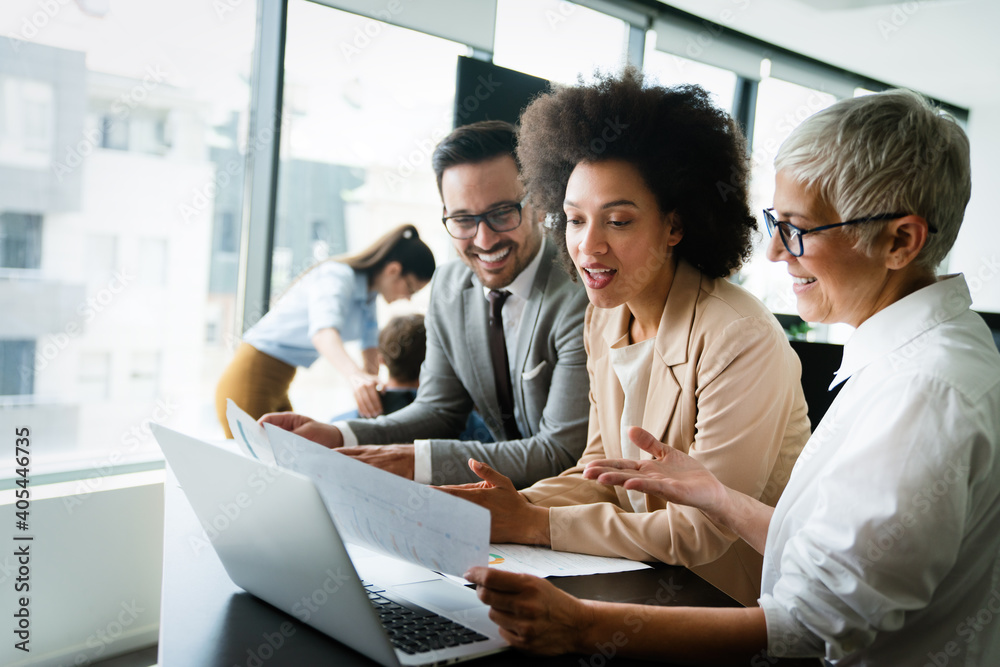Image of business partners discussing documents and ideas Stock Photo ...