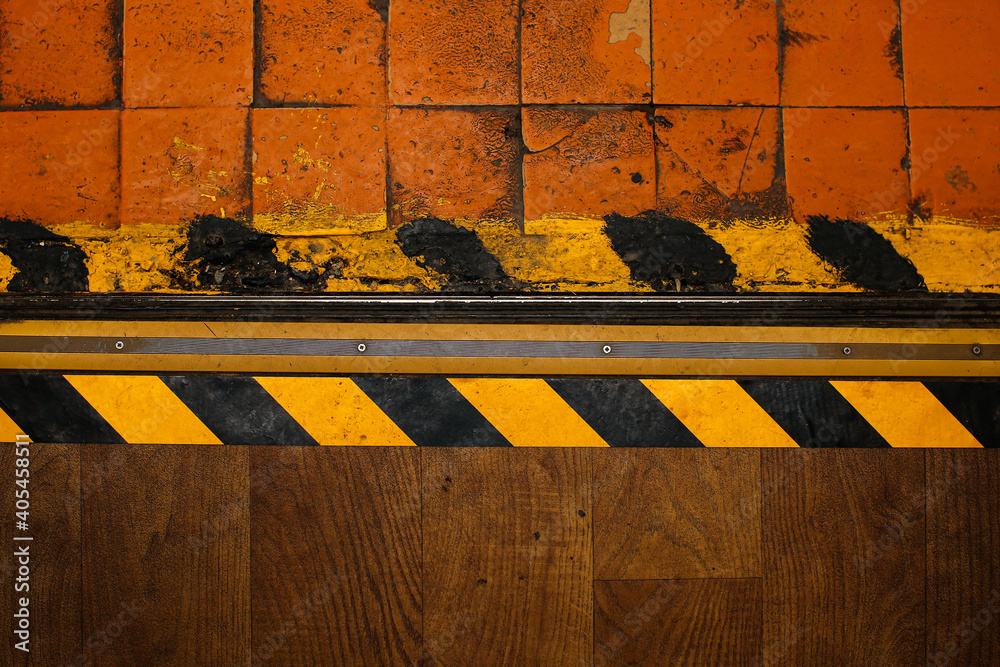 Floor danger zone warning tape yellow with black. Caution - danger. Old ...