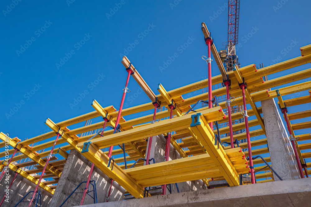 Horizontal formwork and crane at the construction of a residential ...
