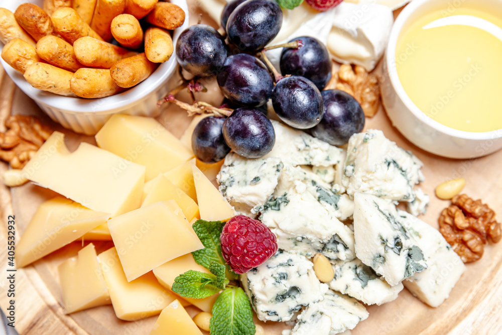 Board with different types of cheese. Cheeses mix set dor blu chedar ...