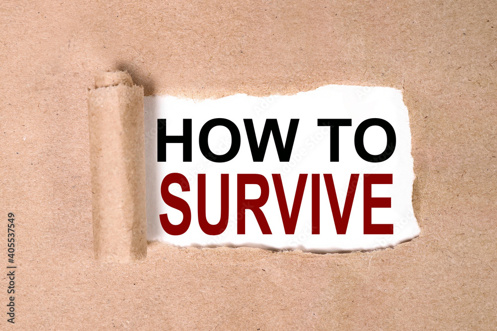 how to survive, text on white paper Against torn paper background Stock ...