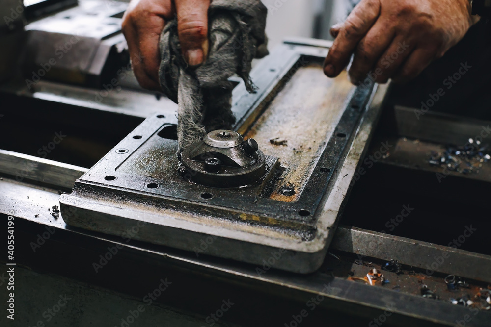 Service and repair of machine tools in a machine shop or workshop ...