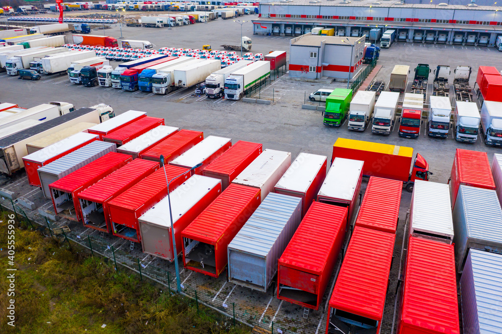 Cargo containers stand on the parking lot of the logistics terminal ...