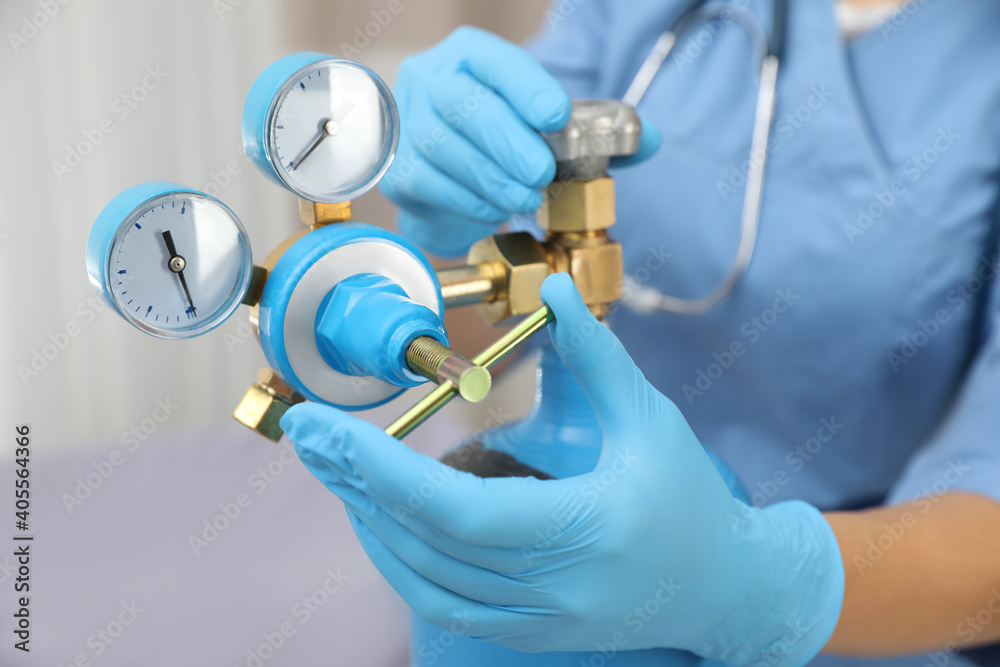 Medical worker checking oxygen tank in hospital room, closeup Stock ...