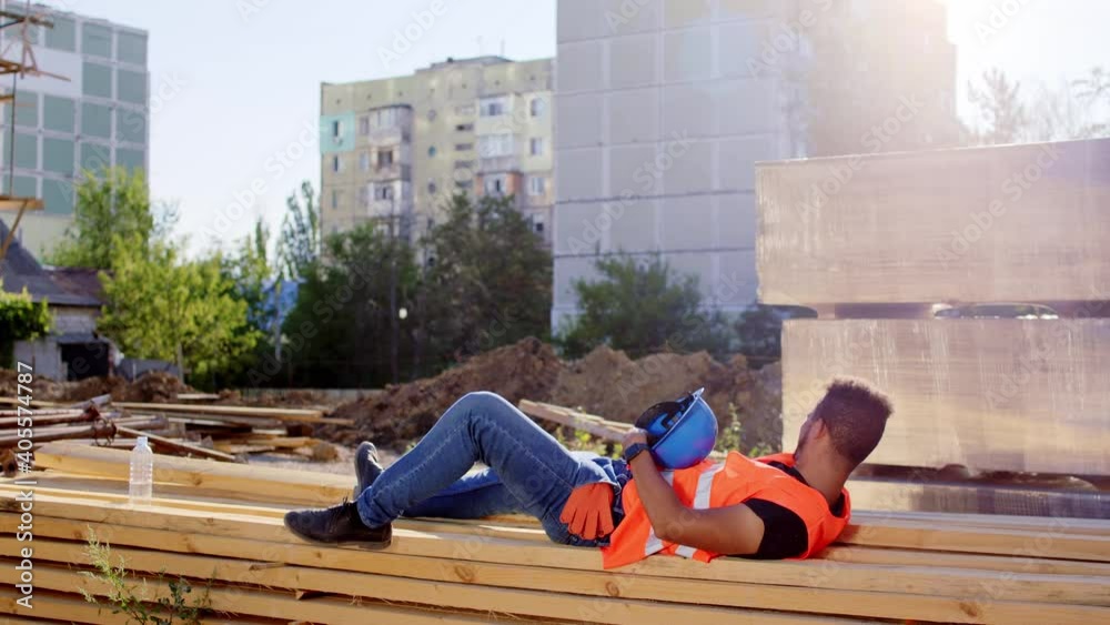 Sleeping at work tired construction worker Afro American he wake up ...