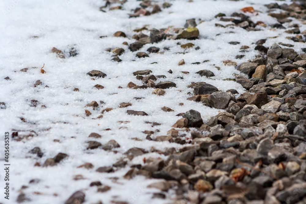 Small gravel road covered in snow texture. Winter pebble background ...