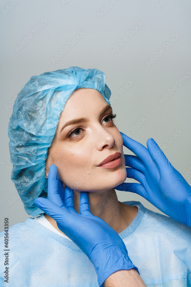 Consultation with plastic surgeon on white background. Cosmetic ...