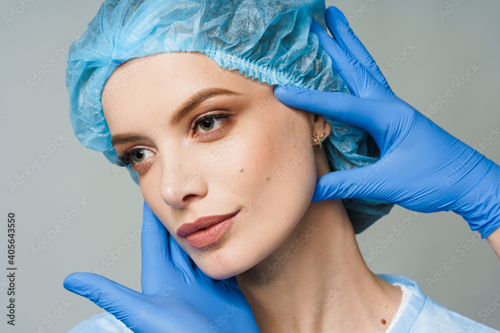 Consultation with plastic surgeon on white background. Cosmetic ...