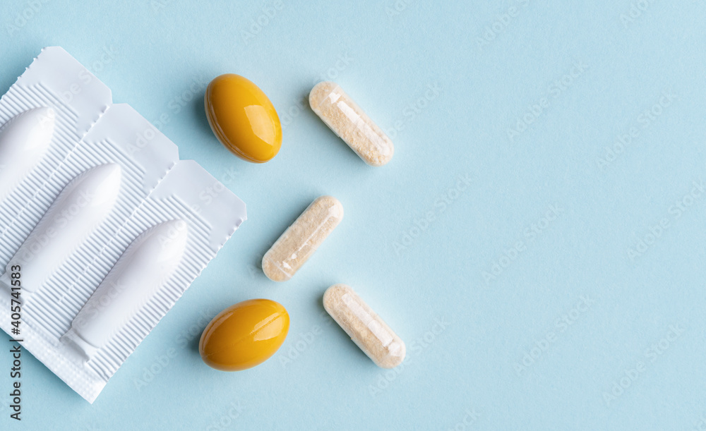 Foto Stock Vaginal suppositories on blue background. Top view. Copy ...