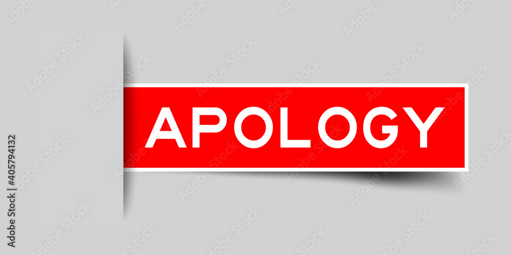 Inserted red color label sticker with word apology on gray background ...