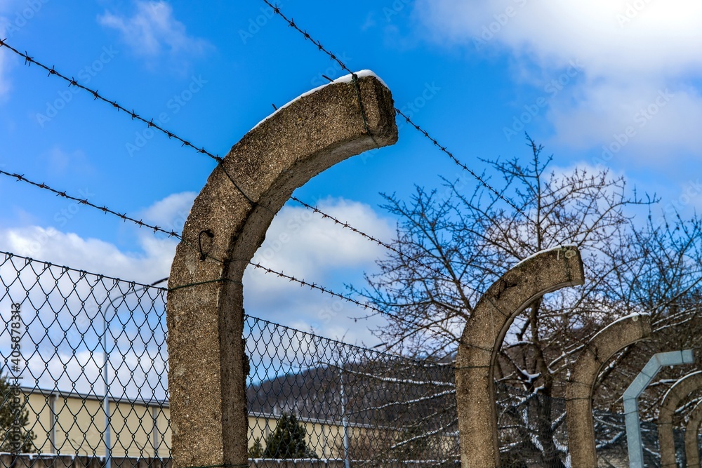 Restricted area - fence with barbed wire. Razor wire jail fence ...