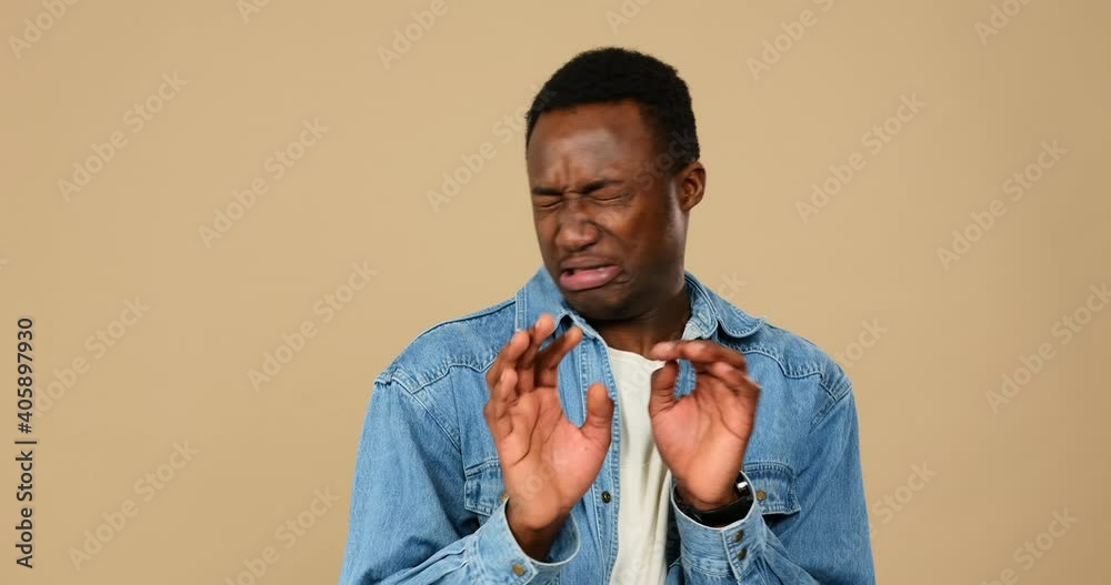 Man doing a gesture of disgust over beige background Stock Video ...