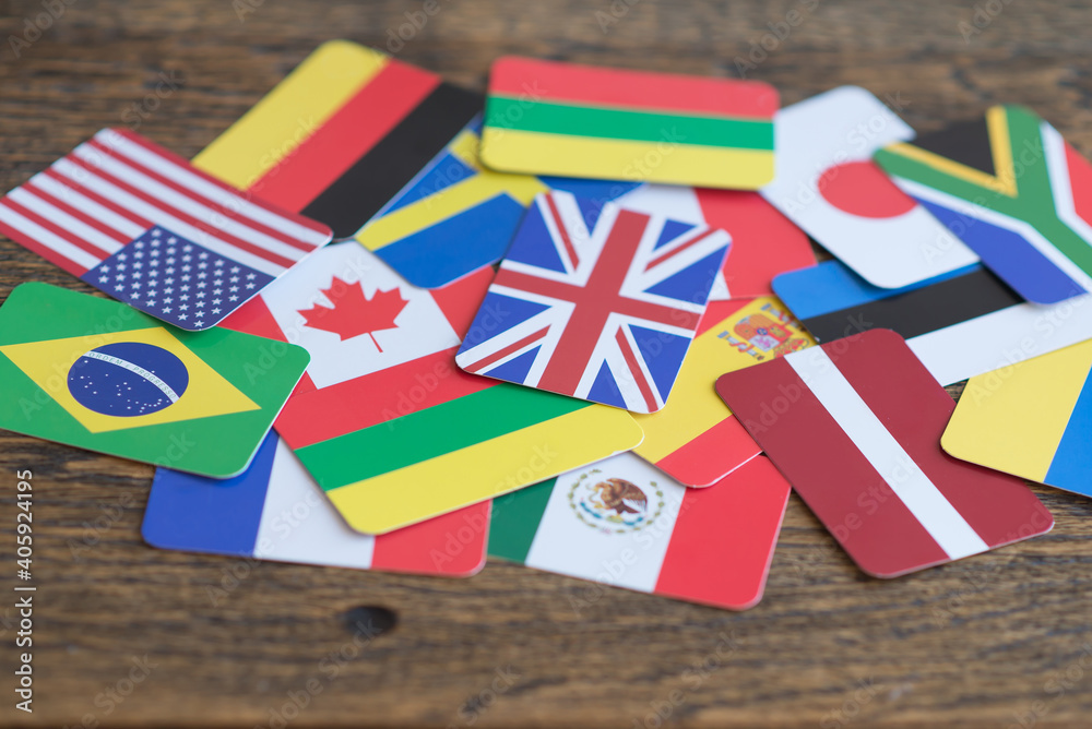 paper cards with state flags of different countries on the table close ...