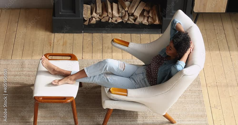 Top view young african woman resting with eyes closed hands behind head ...
