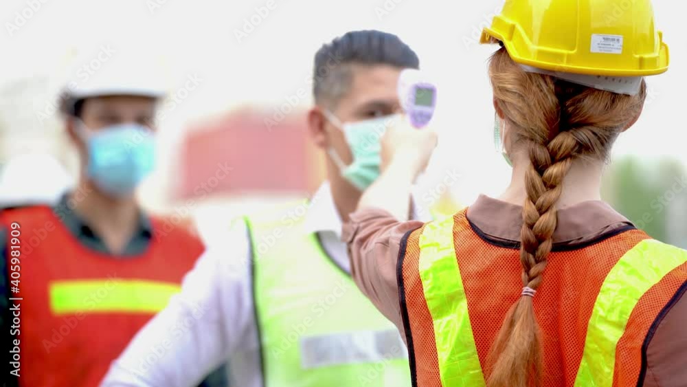 Factory woman worker in a face medical mask and safety dress used ...