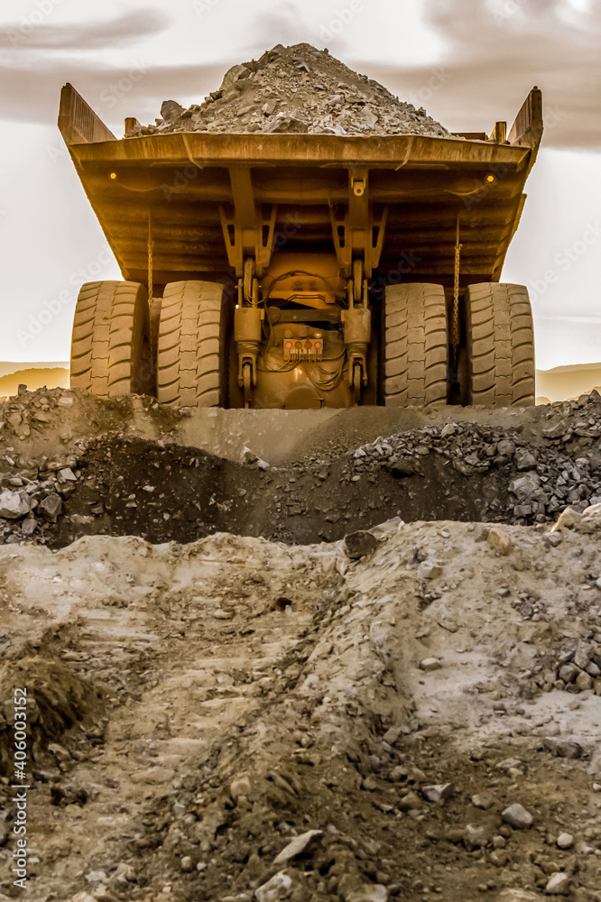 Truck loaded with crushed rock fragments for transporting in platinum ...