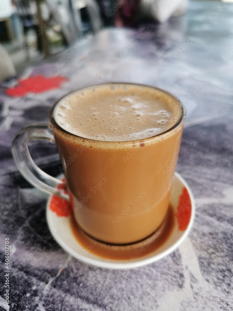Tea with milk or popularly known as Teh Tarik in Malaysia Stock Photo ...