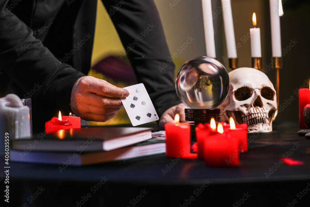 Male fortune teller with cards at table Stock Photo | Adobe Stock