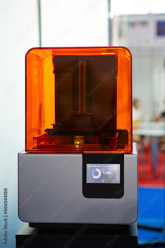 A stereolithography 3d printer in the laboratory prints a structure ...