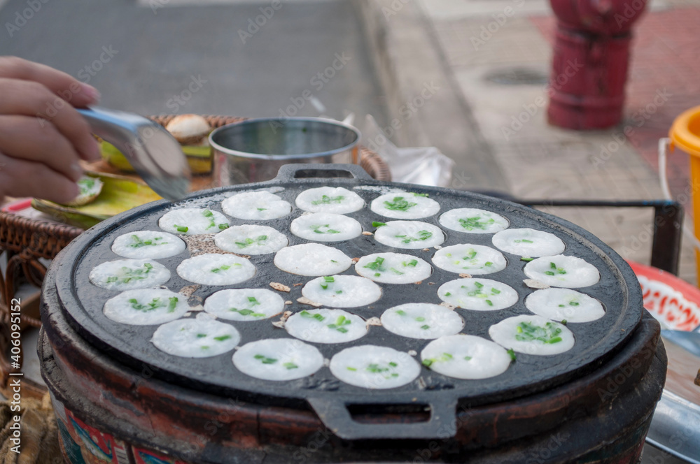 Kanom Krok, a traditional Thai dessert made from crushed coconut meat ...