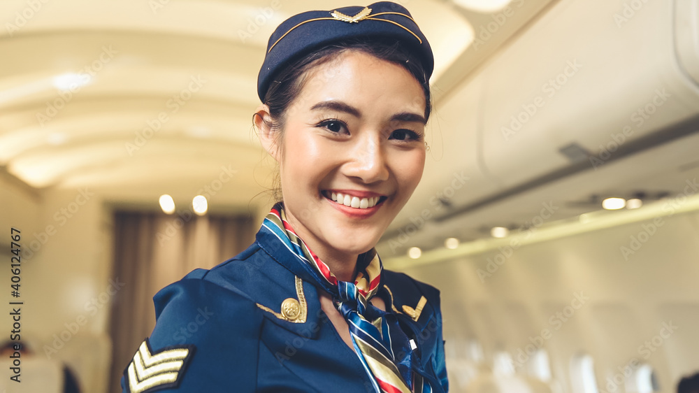 Cabin crew or air hostess working in airplane . Airline transportation ...