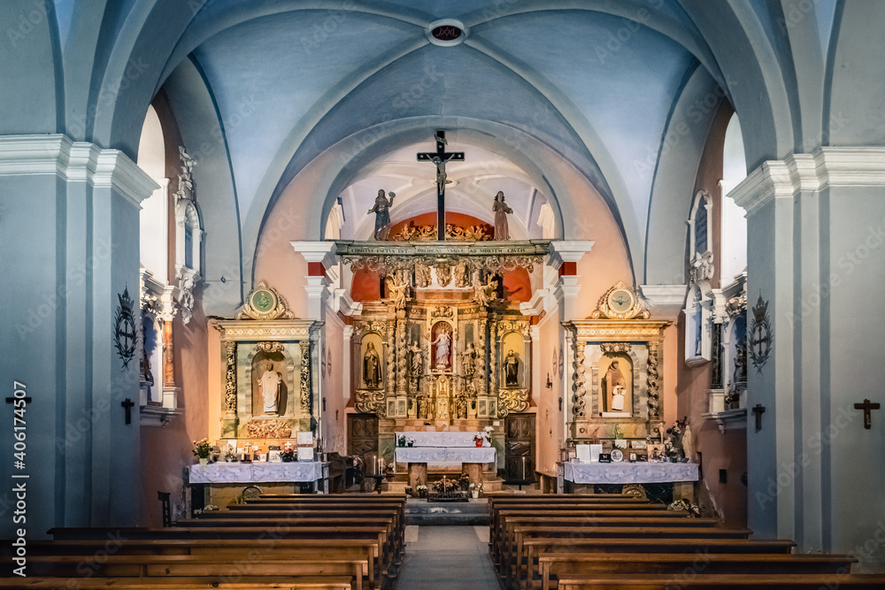 Inside a small christian church with wooden cross, golden altar and ...