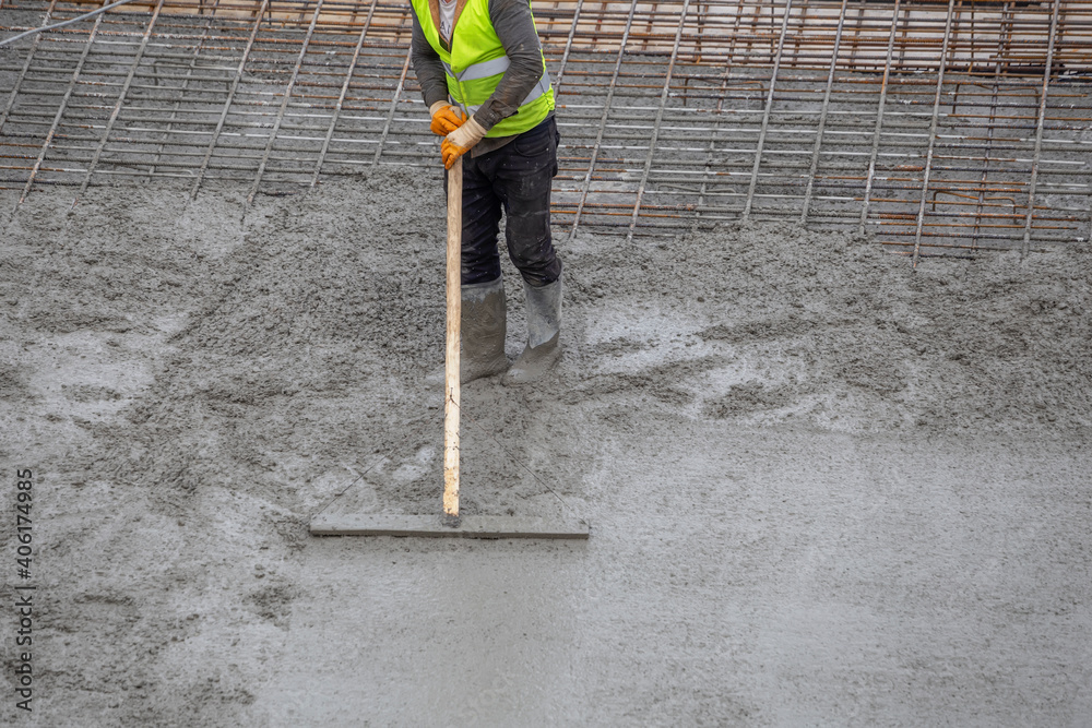 Leveling the concrete floor of the foundation formwork Stock Photo ...
