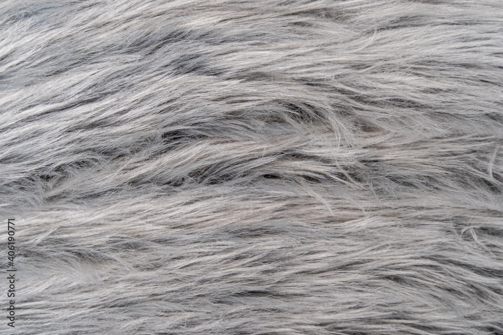 Grey fur rug texture of a textile with long fibers. Natural structure ...