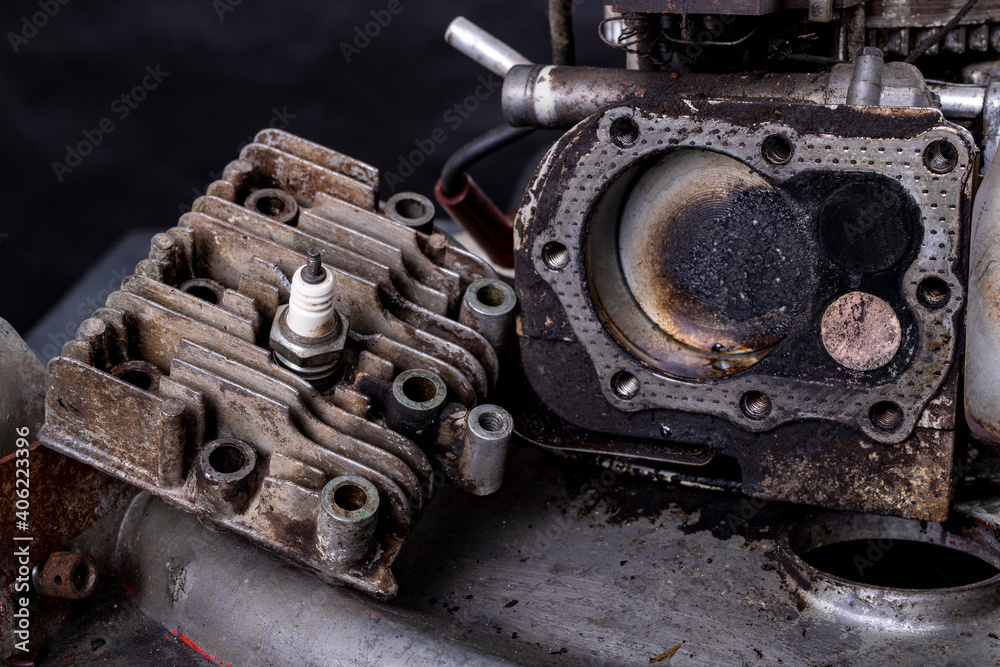 Repair of a small internal combustion engine from a lawn mower. Head ...