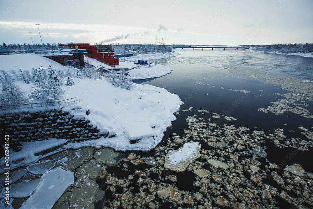 Winter view of Hydroelectric Power Plant with a dam in Lapland, Finland ...