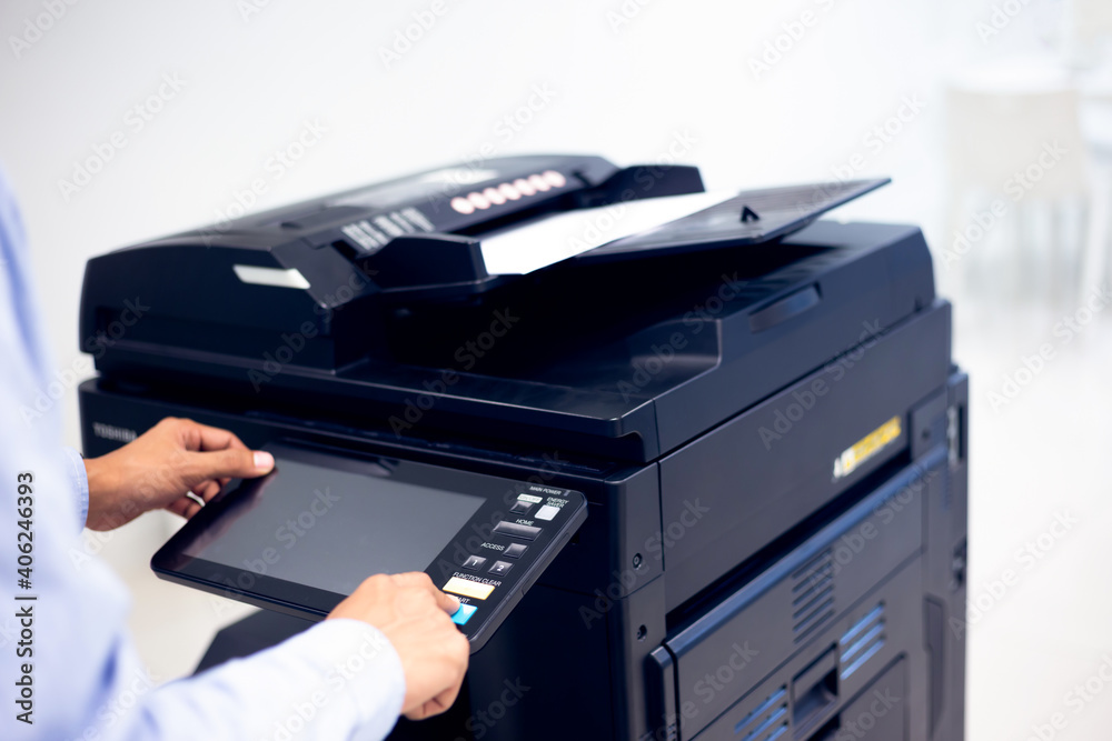 Bussiness man Hand press button on panel of printer, printer scanner ...