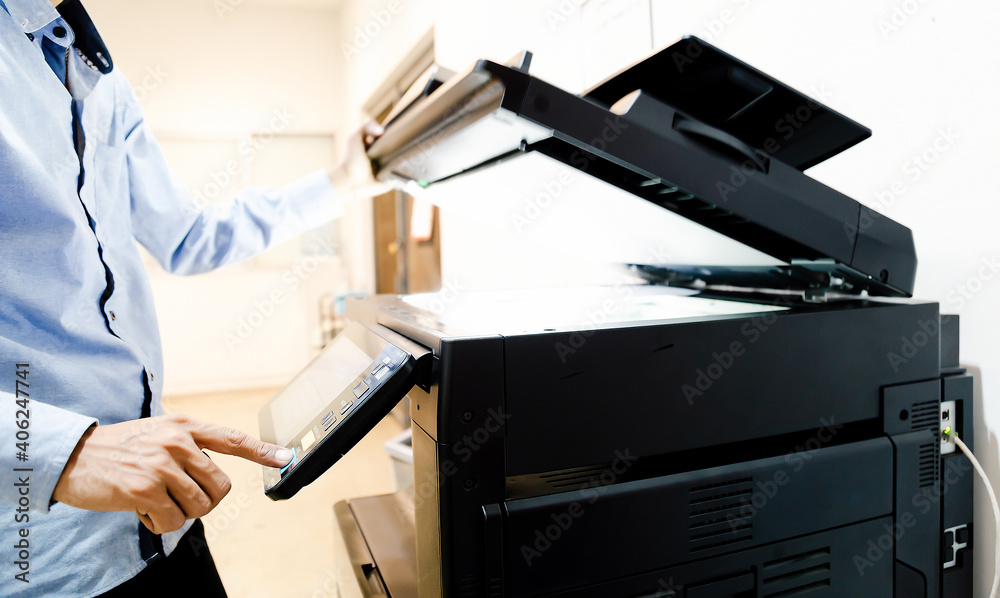 Bussiness man Hand press button on panel of printer, printer scanner ...