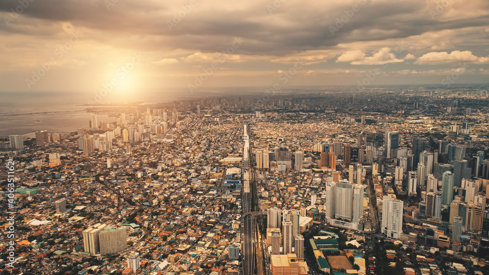 Sun cityscape of port town Manila aerial. Sunrise light over modern ...