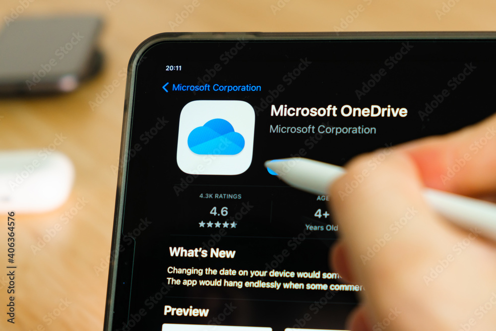 Microsoft OneDrive logo shown by apple pencil on the iPad Pro tablet ...