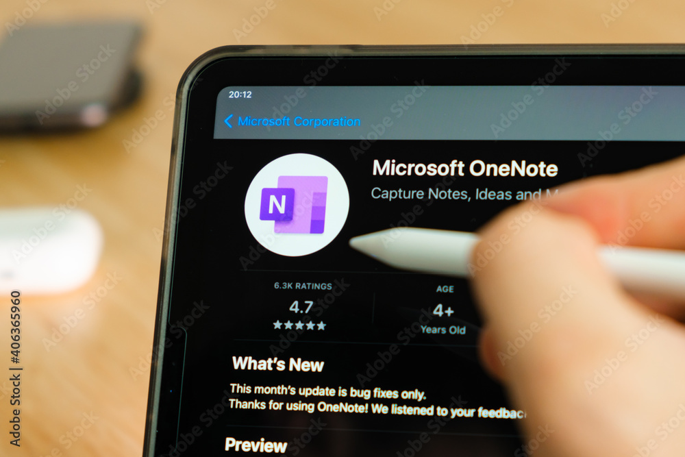 Microsoft OneNote logo shown by apple pencil on the iPad Pro tablet ...