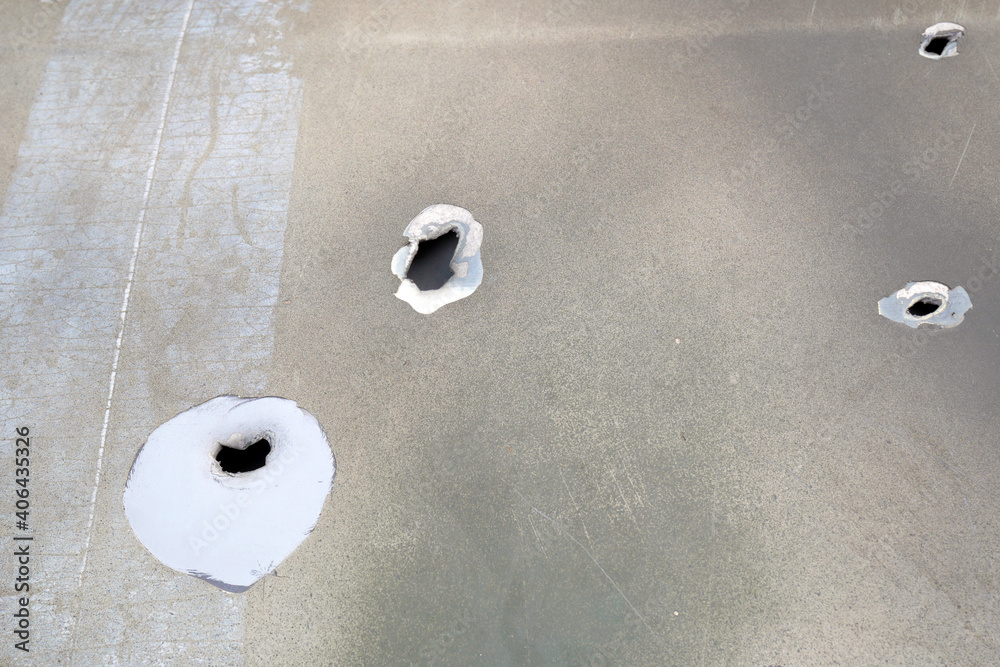 cracked and chipped broken metal background with holes, abstract ...